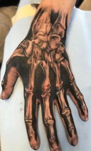 100+ Stunning Skeleton Hand Tattoos & Meanings - Tattoo Me Now